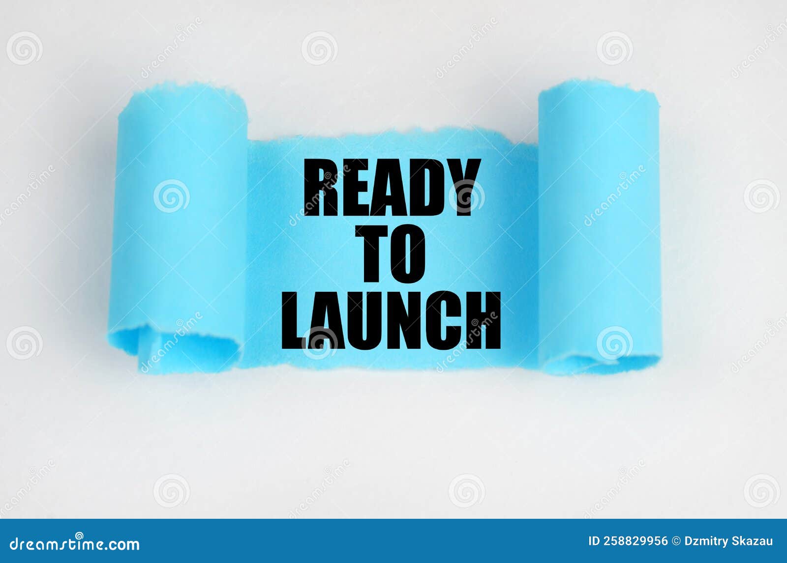 On a White Surface, a Blue Scroll of Paper with the Inscription - Ready ...