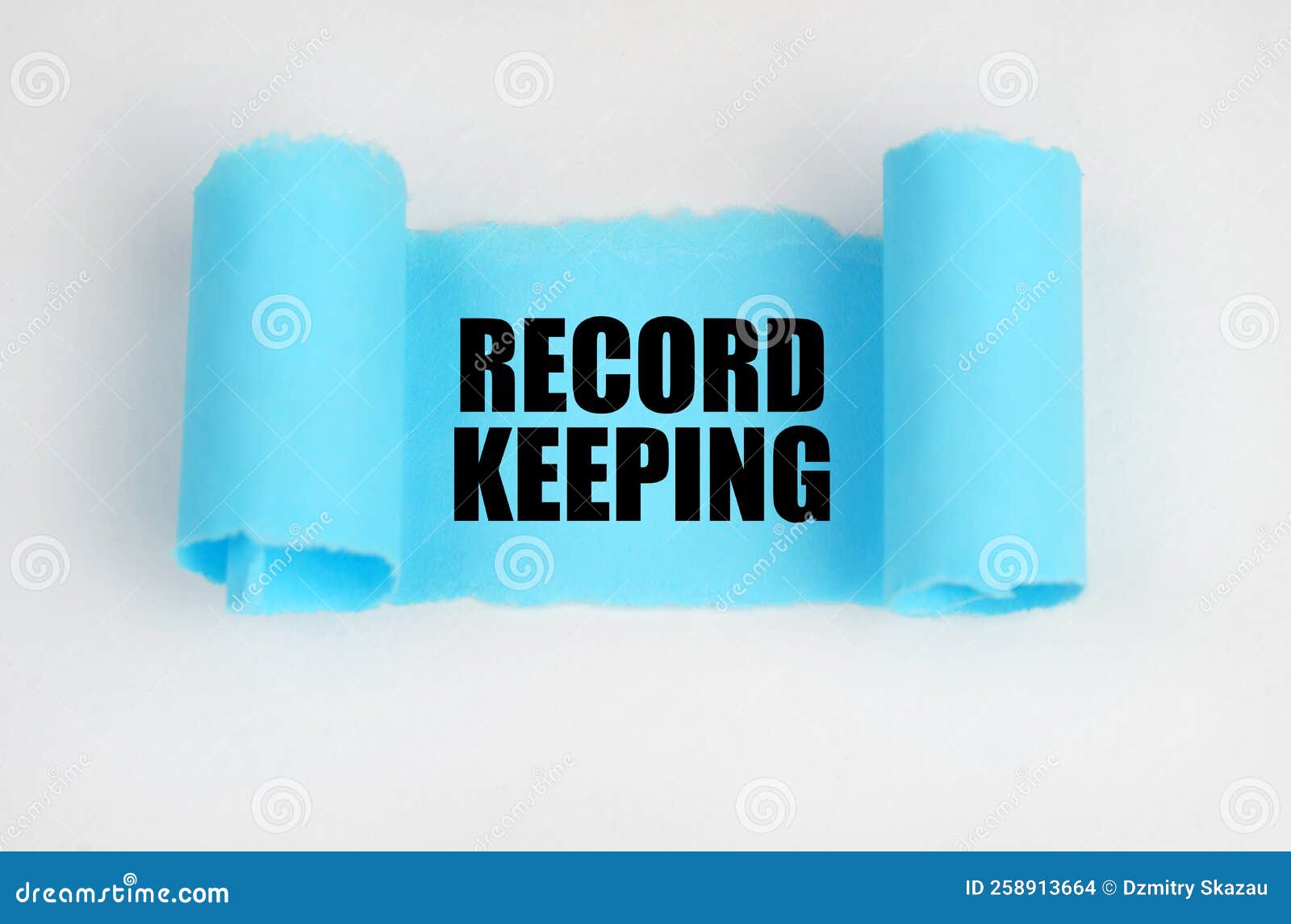 On a White Surface, a Blue Scroll of Paper with the Inscription ...