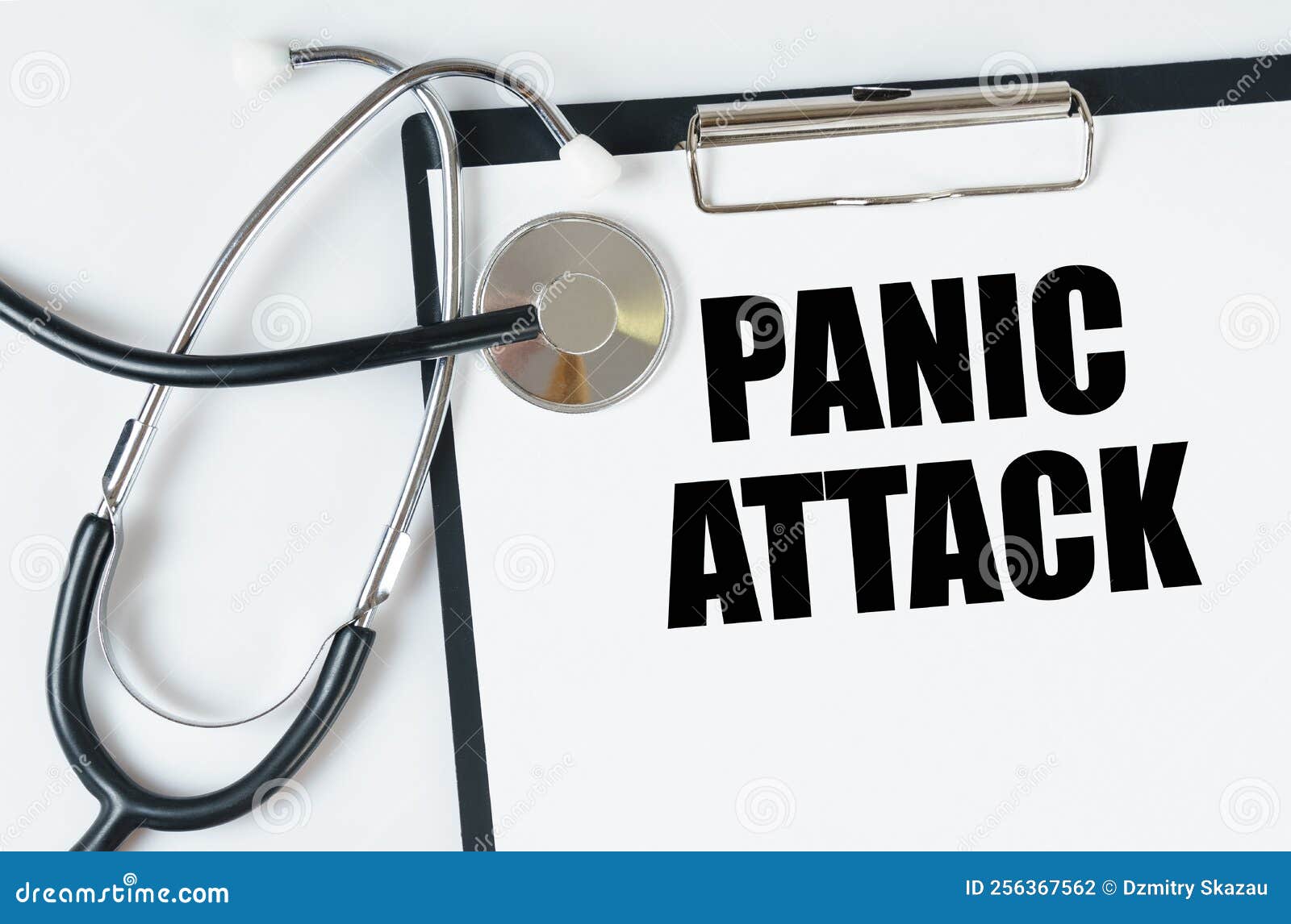 On a White Surface, a Stethoscope and a Tablet with an Inscription ...