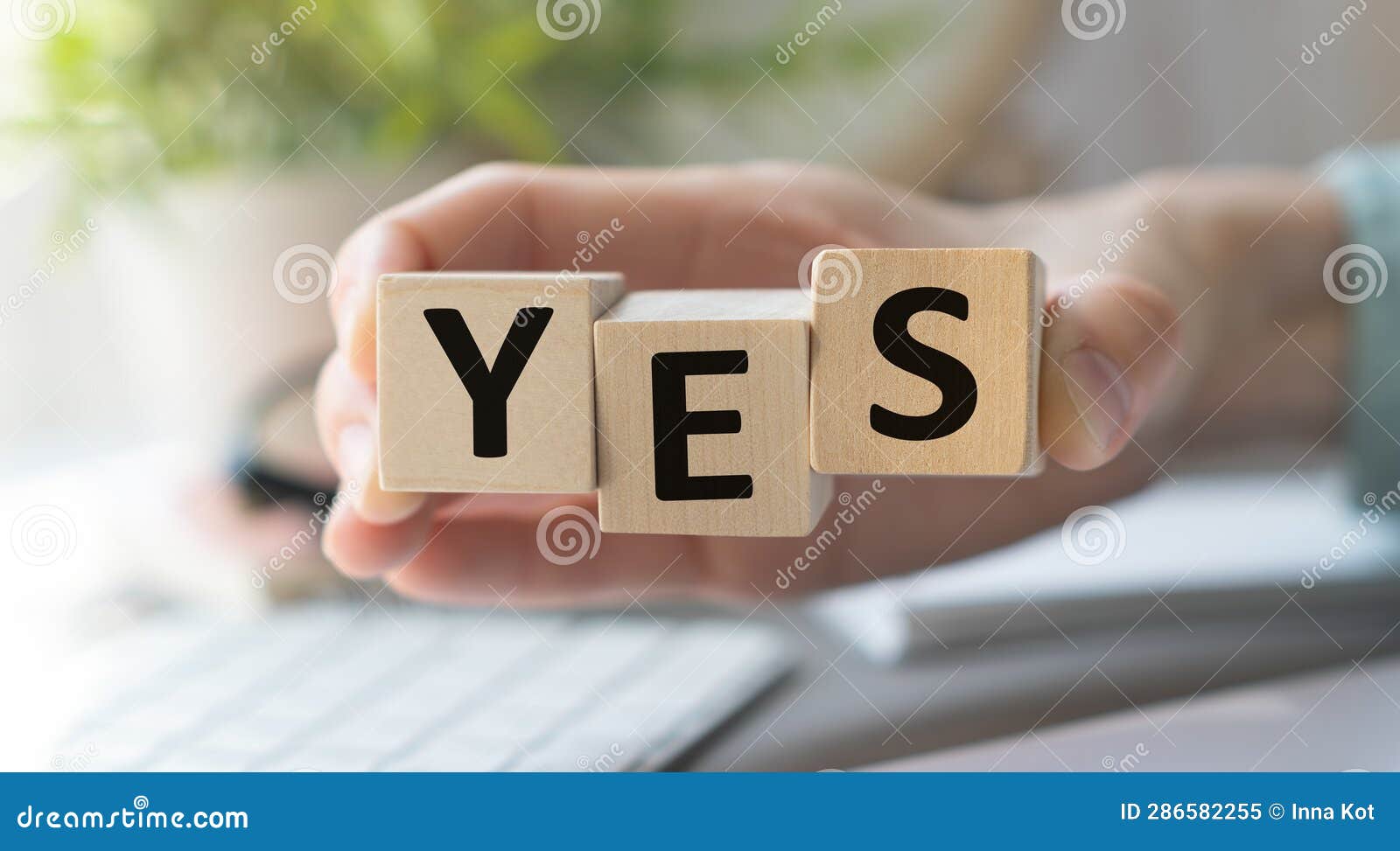 On a White Surface, a Woman Puts Cubes with the Inscription - YES Stock ...