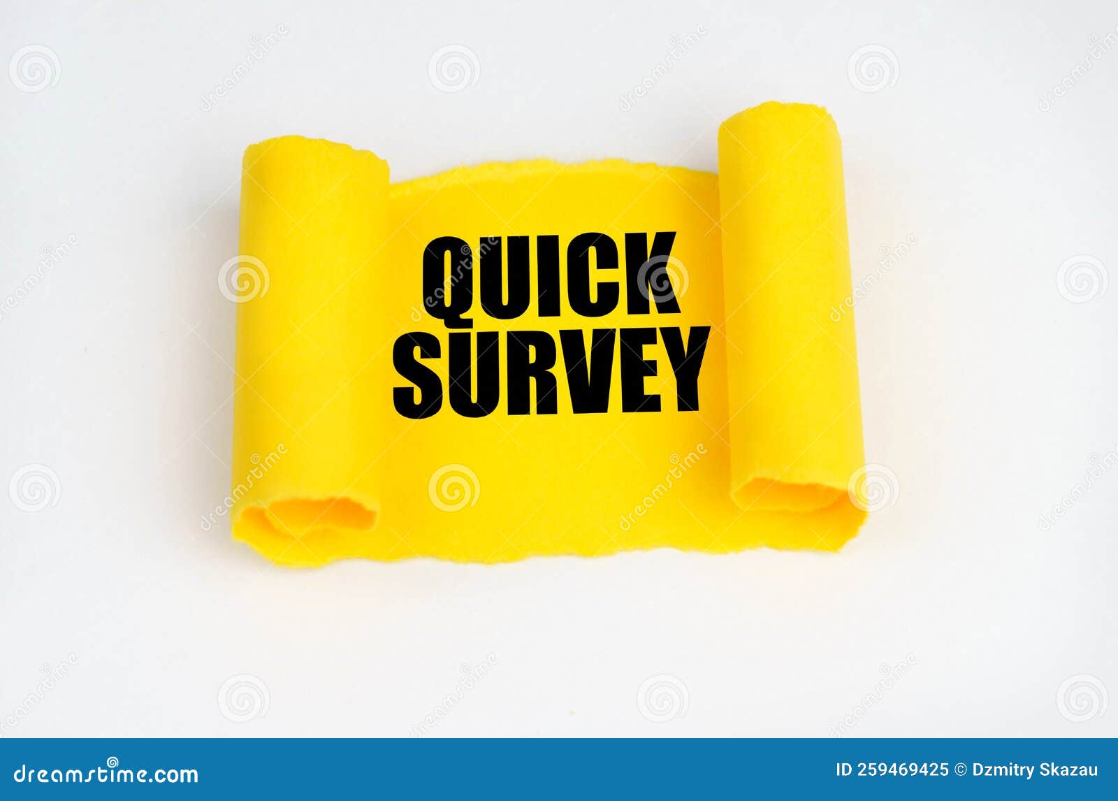 On a White Surface, a Yellow Scroll of Paper with the Inscription ...