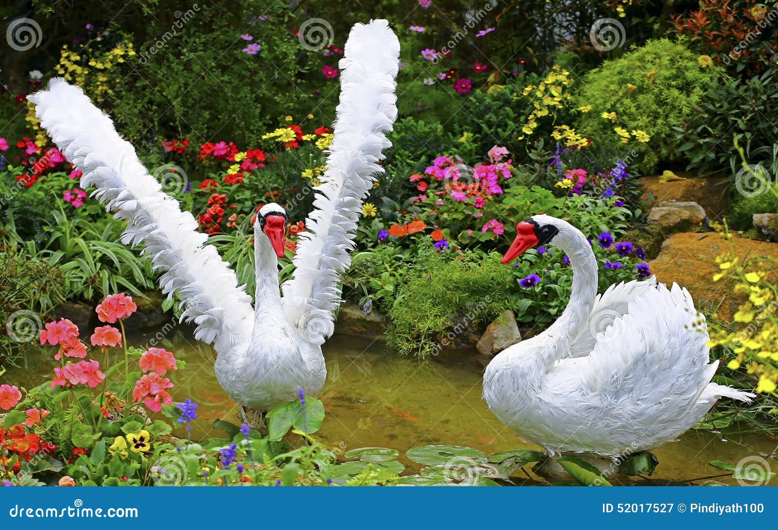 White Swans Decoy in Spring Garden Stock Image - Image of elegant ...