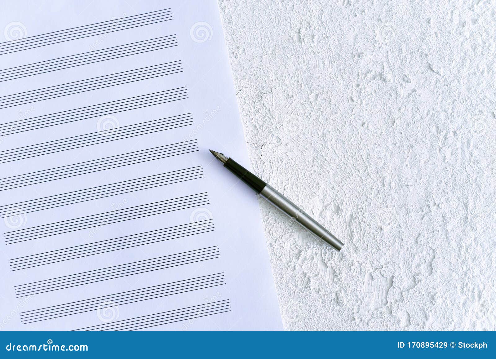 On a White Table is a White Sheet of Musical Notes for Recording ...