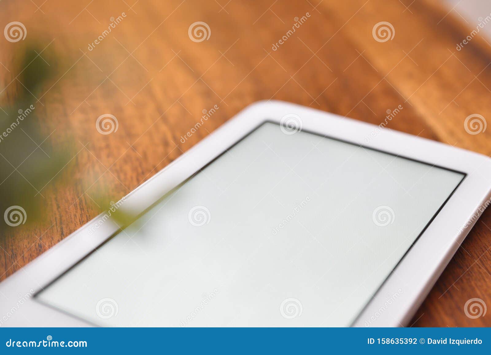 White Tablet with White Screen on Wood Table Elevated Stock Photo ...