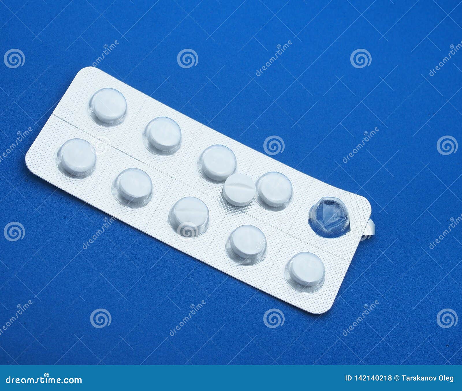 White Tablets on a Blue Background. One Tablet without Packaging, the ...