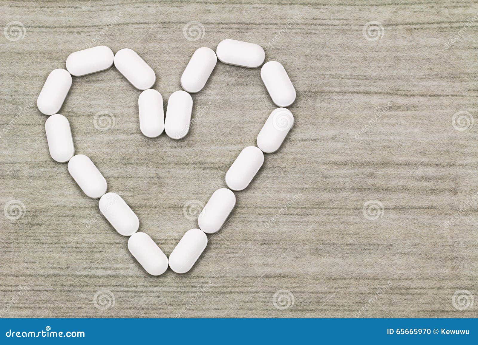 White Tablets in a Heart Shaped Symbol with Copyspace Stock Photo ...