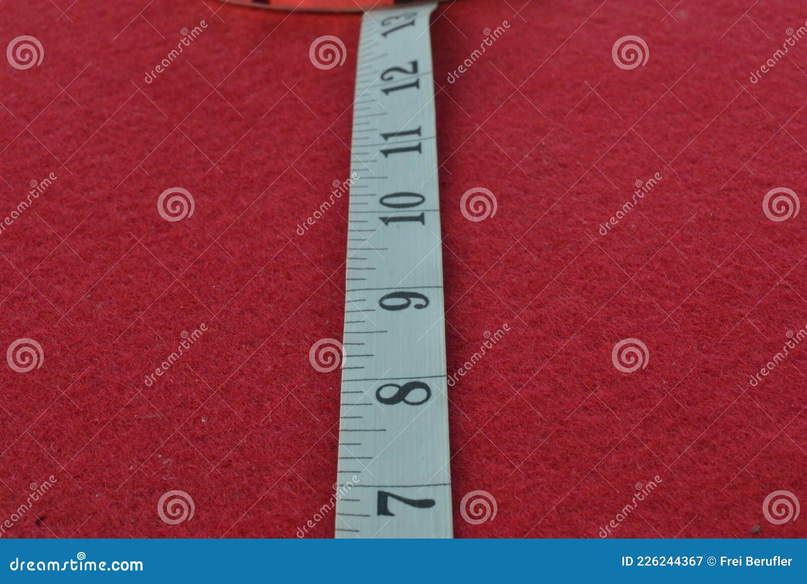White Tape Measure on a Red Background with the Numbers Stock Image ...