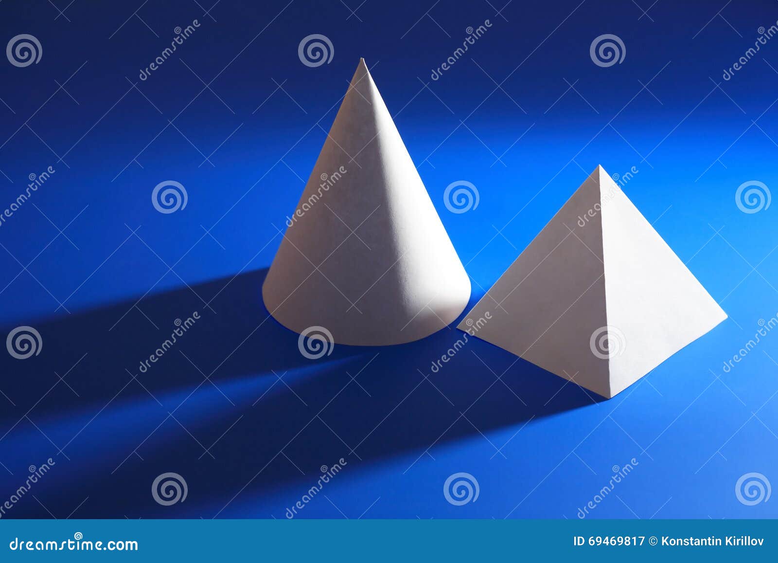 White Taper and Pyramid on Blue Stock Image - Image of paper, geometry ...