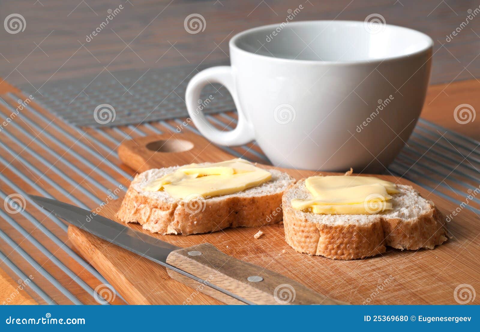 White Tea Cap with Bread and Butter Stock Photo - Image of meal, grain ...