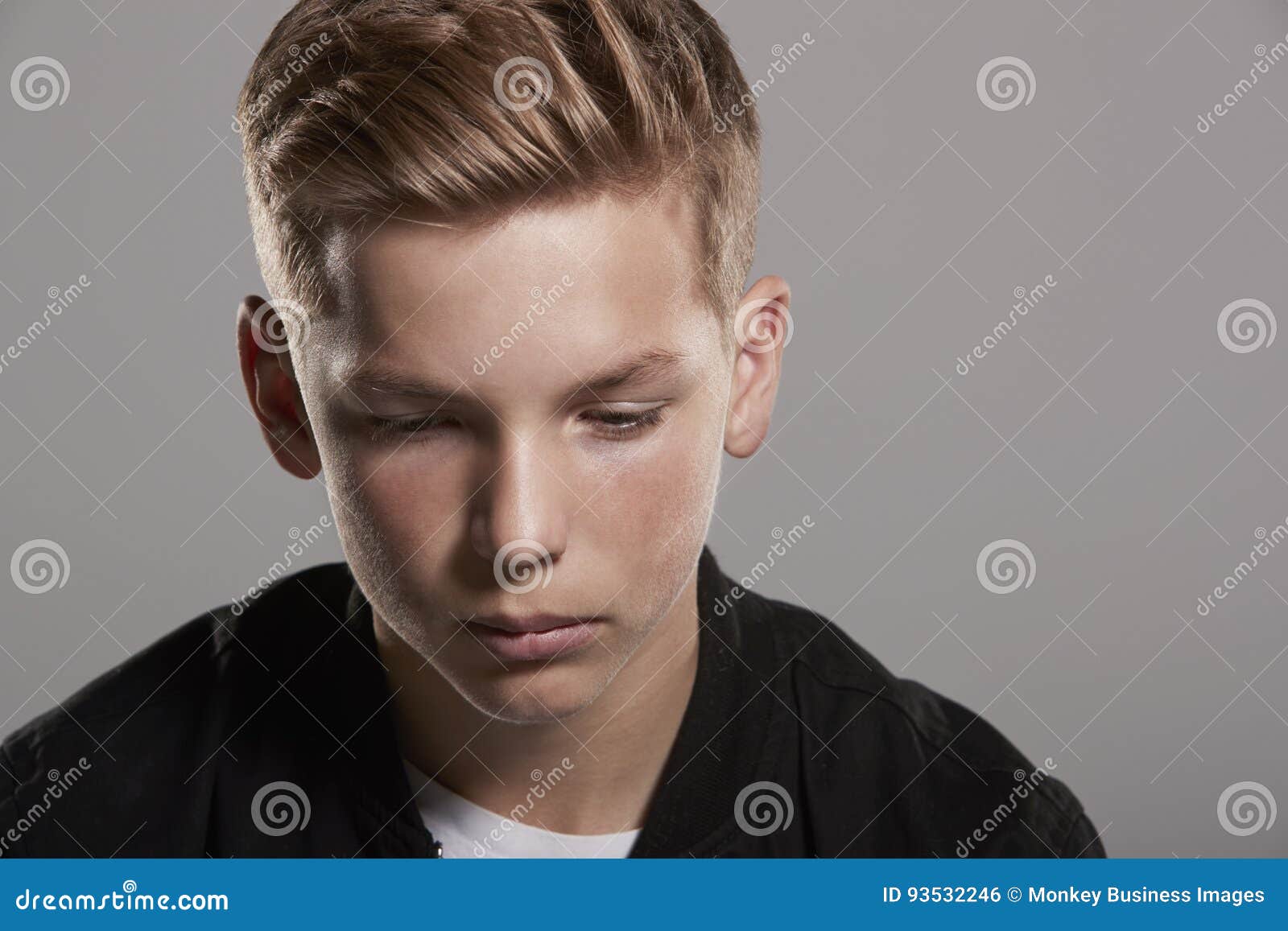 White Teenage Boy Looking Down, Close Up Stock Photo - Image of ...