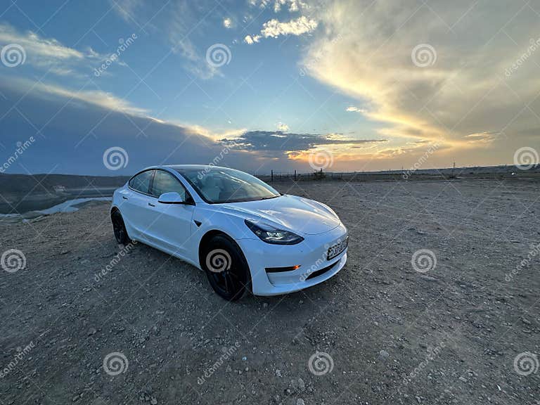 White Tesla Model 3 Parked Outdoors at Sunset Editorial Photography ...