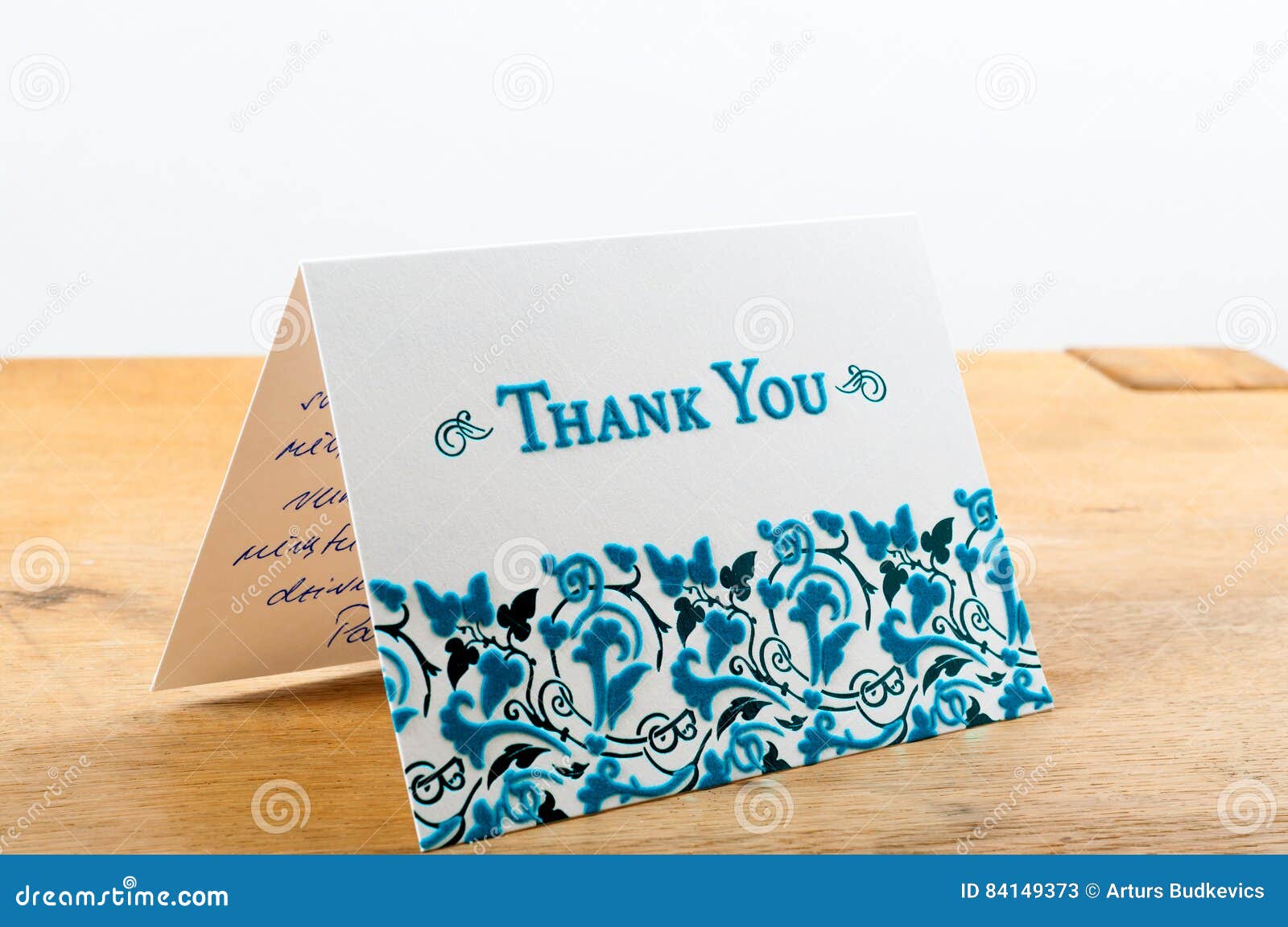White Thank You Card with Blue Letters with Note Written by Hand Stock ...