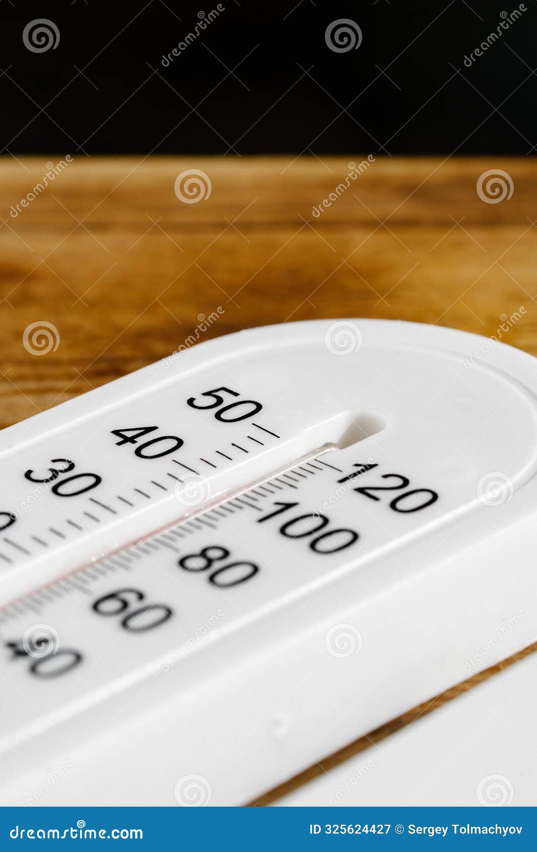 White Thermometer on Wooden Surface Showing a Temperature of 15 Degrees ...