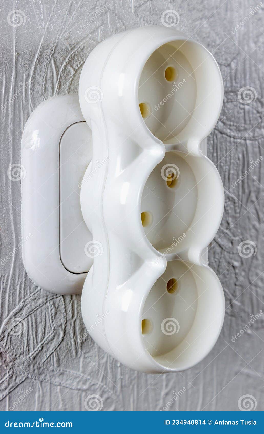Side View of a Three-pronged Socket Adapter on a Wall Stock Photo ...