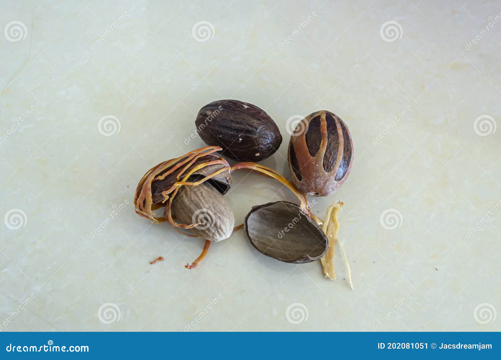 Broken and Whole Nutmegs with Mace on Counter Stock Image - Image of ...