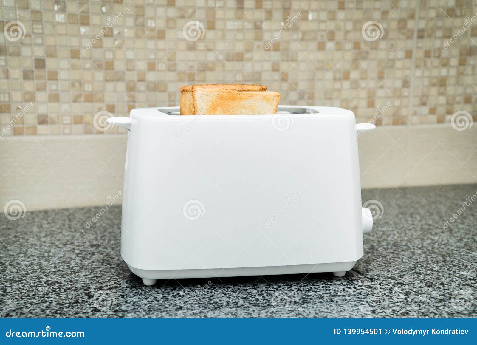White Toaster with Toasted Bread for Breakfast Inside. Gray Table Stock ...