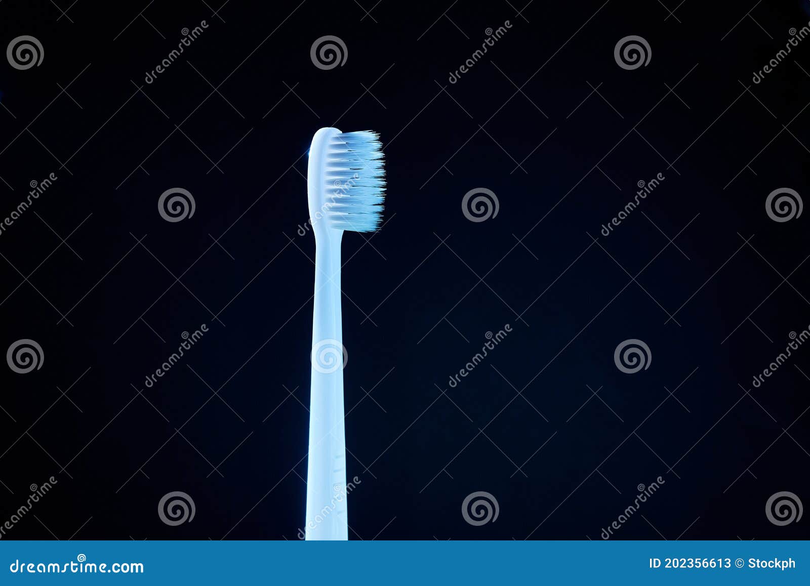 White Toothbrush in Blue Light. Dark Background Stock Image - Image of ...