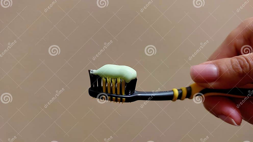 Macro Close Up View of a Plastic Toothbrush with Toothpaste on Blue ...