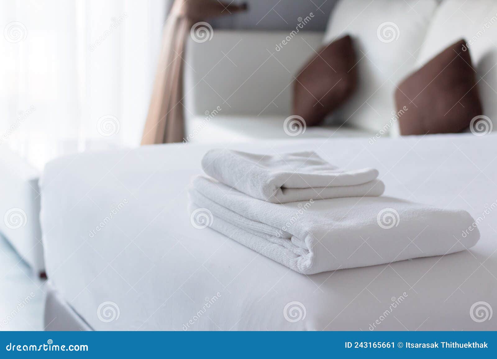 White towel on bed stock image. Image of luxury, hotel - 243165661