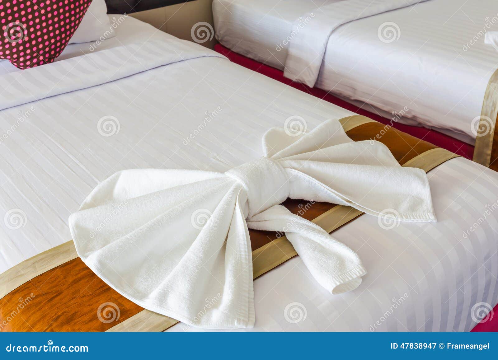White Towel Folded in Bow Shape on Bed Stock Image - Image of fold ...