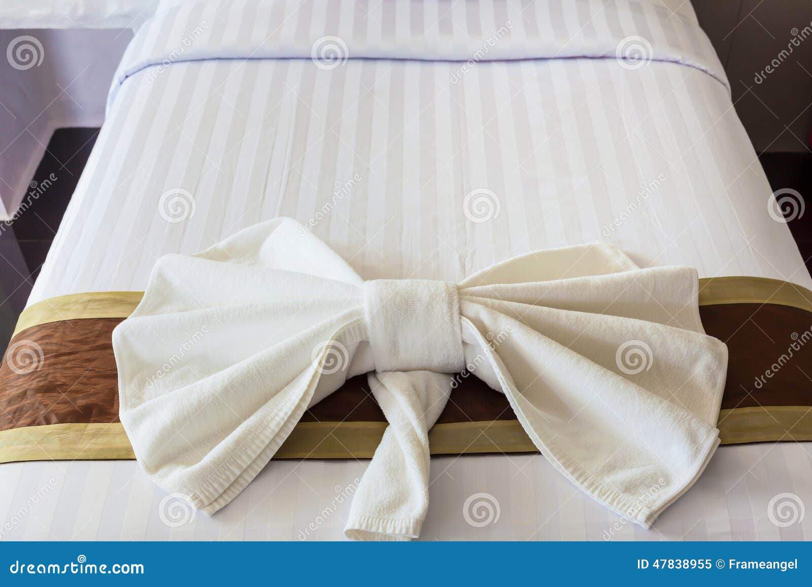 White Towel Folded in Bow Shape on Bed Stock Image - Image of resort ...