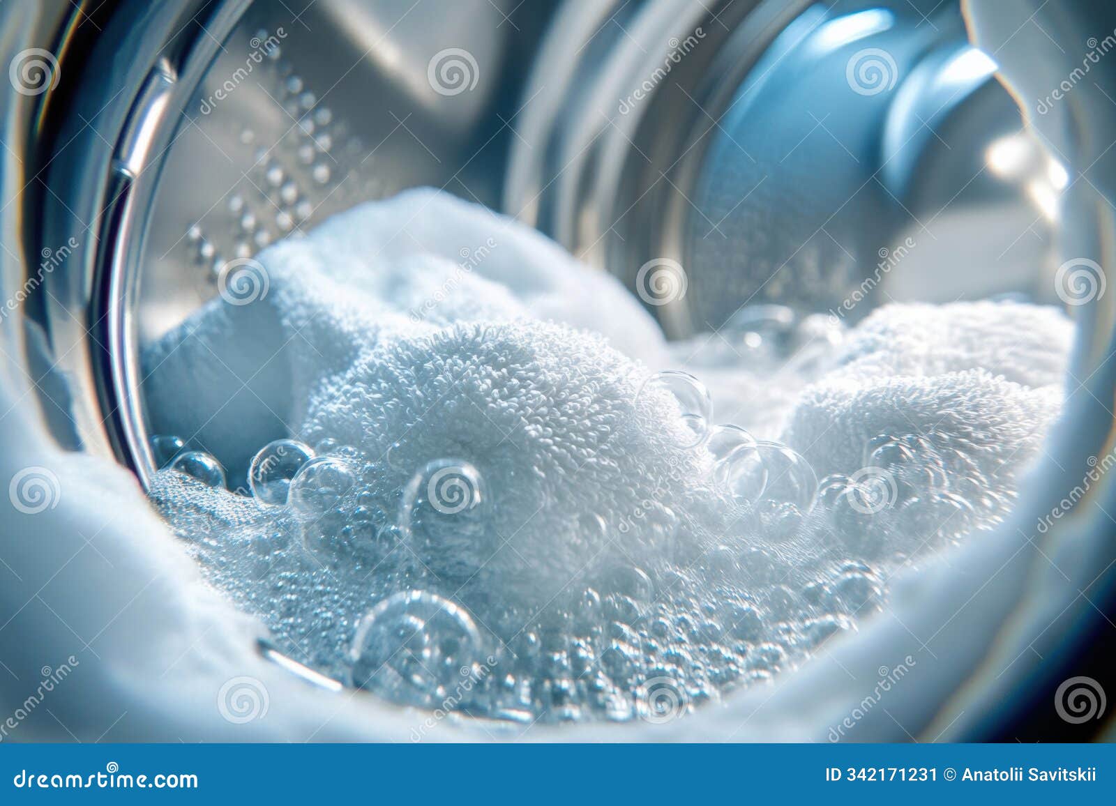 White Towels are Soaking in Soapy Water Inside a Washing Machine Drum ...