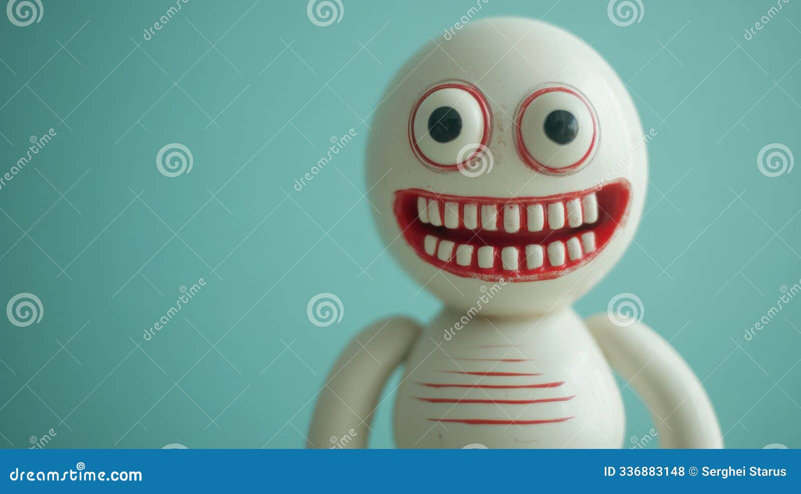 A White Toy with Red Eyes and a Big Smile on Its Face, AI Stock Photo ...