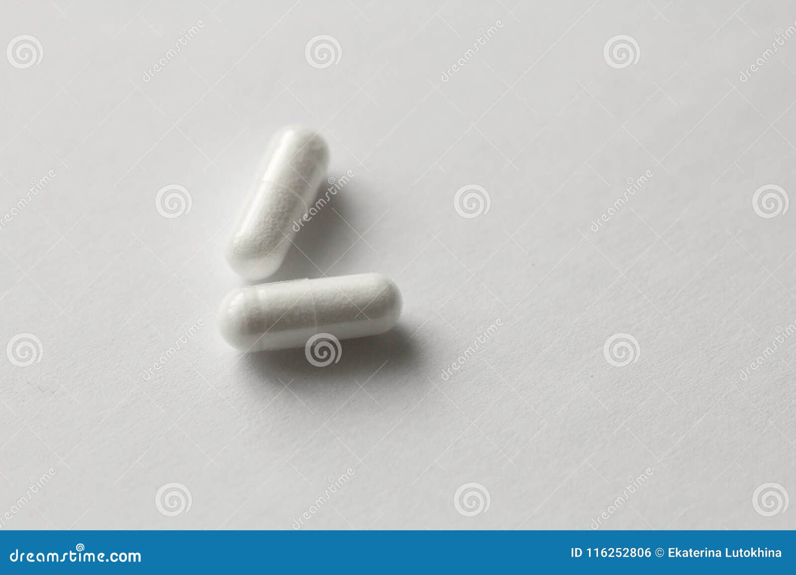 White Transparent Capsules or Tablets on the White Background. M Stock ...