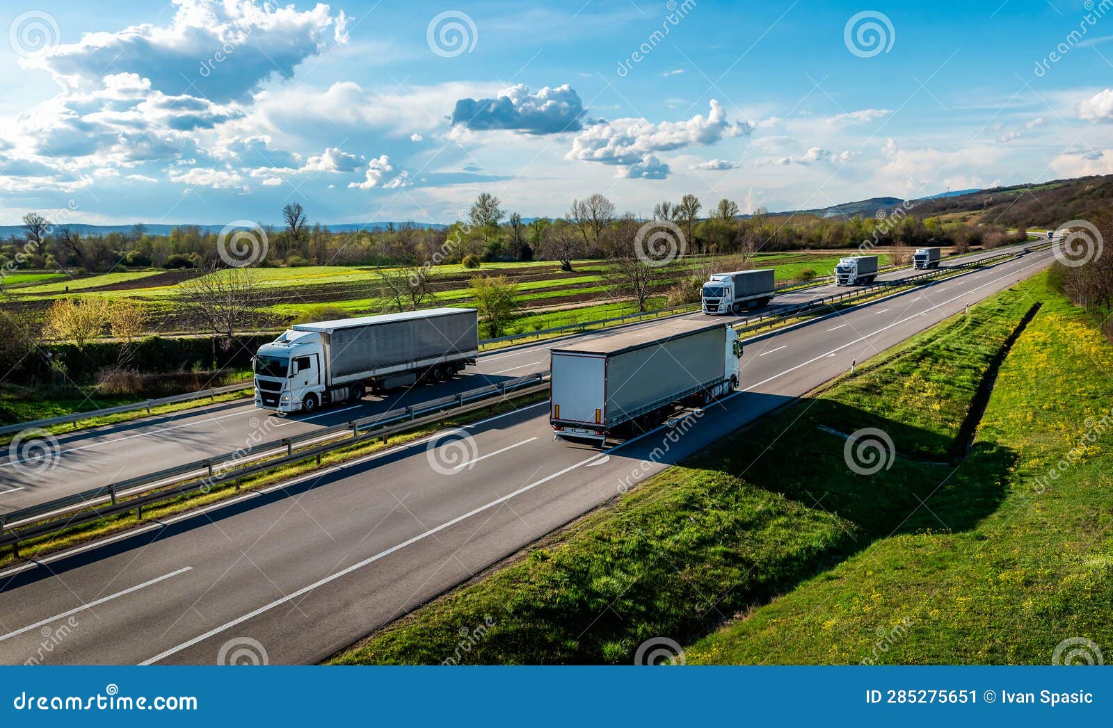 White Transportation Trucks in Lines Passing Stock Image - Image of ...