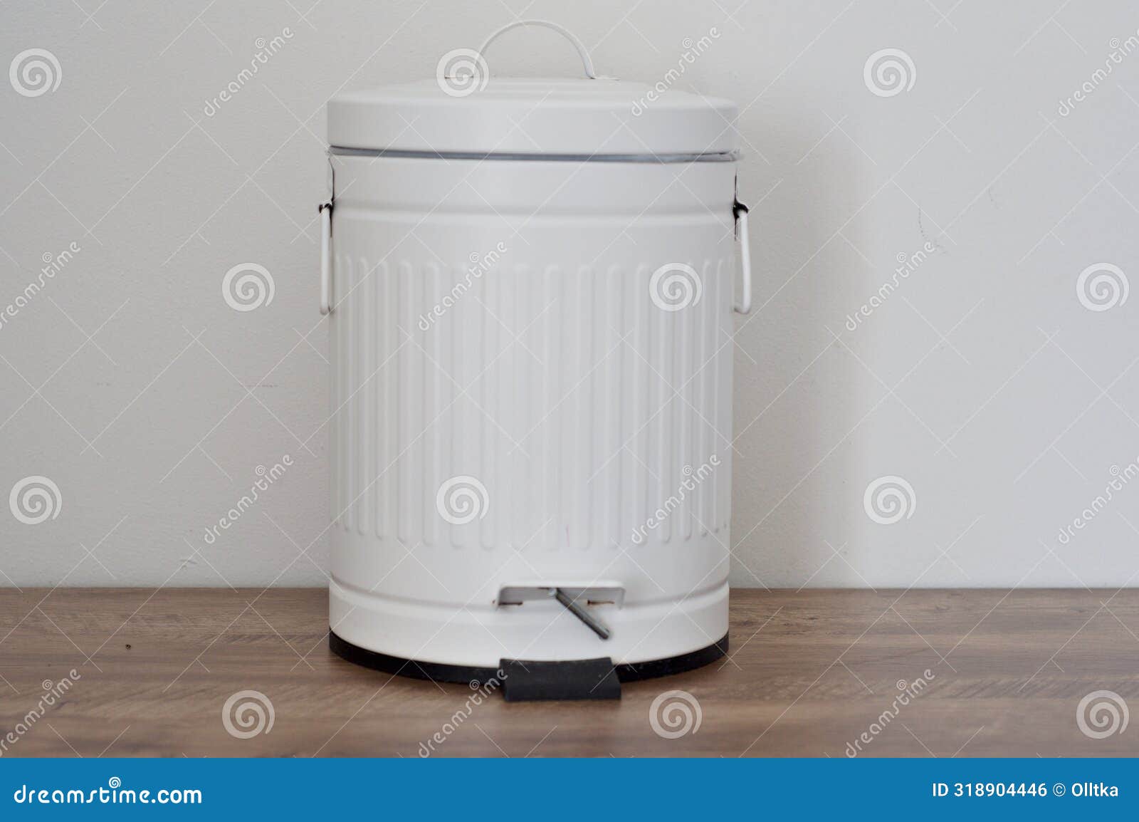 White Trash Can with Copy Space on White Wall. Trash Bin Stock Photo ...