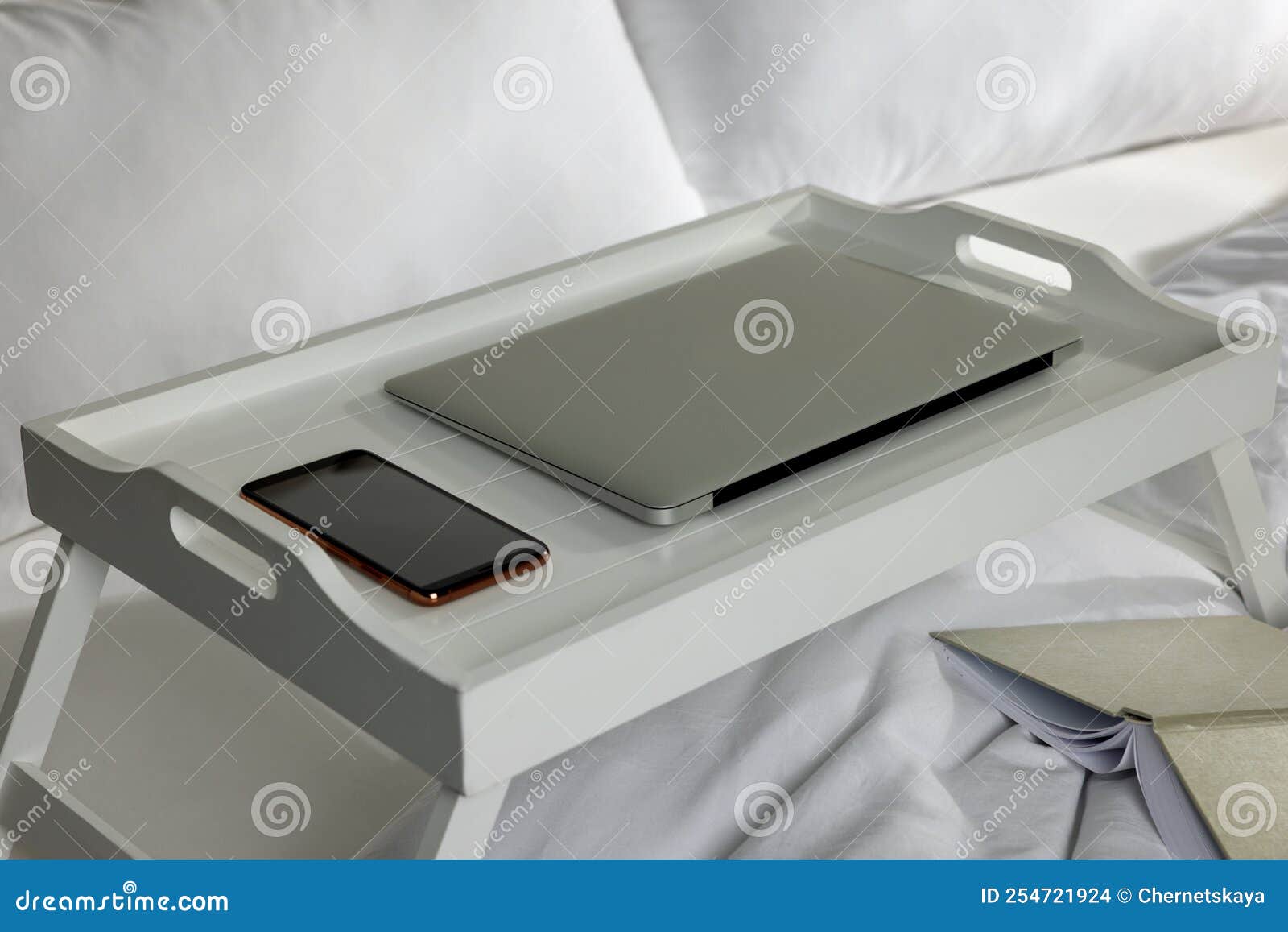 White Tray with Modern Laptop and Smartphone on Bed Stock Photo - Image ...