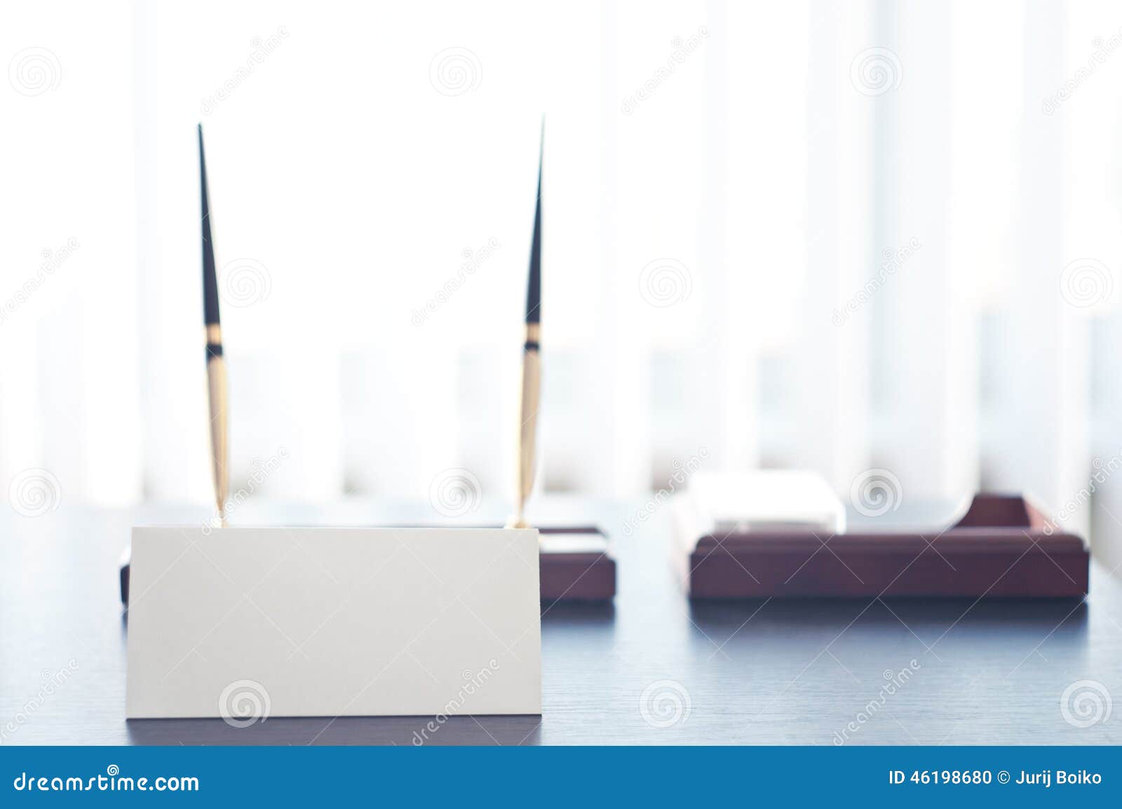 White Triangular Sign for the Label Standing on a Black Table. Stock ...