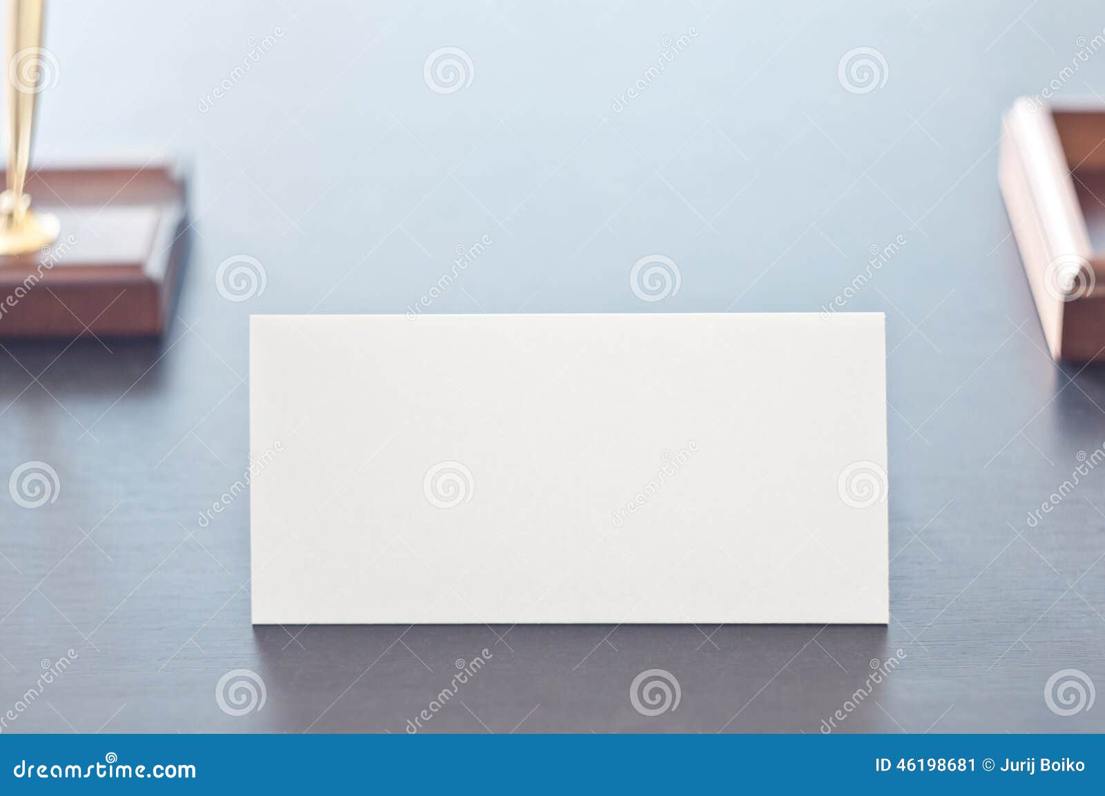 White Triangular Sign for the Label Standing on a Black Table. Stock ...