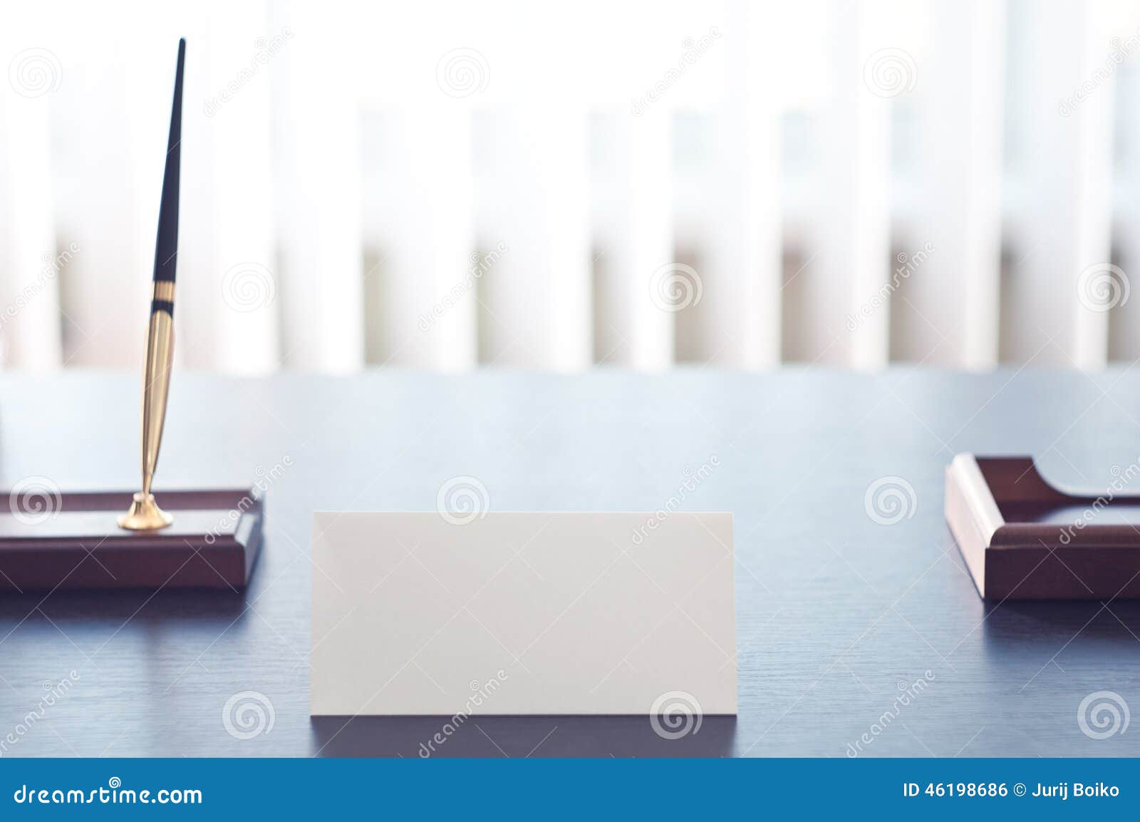 White Triangular Sign for the Label Standing on a Black Table. Stock ...
