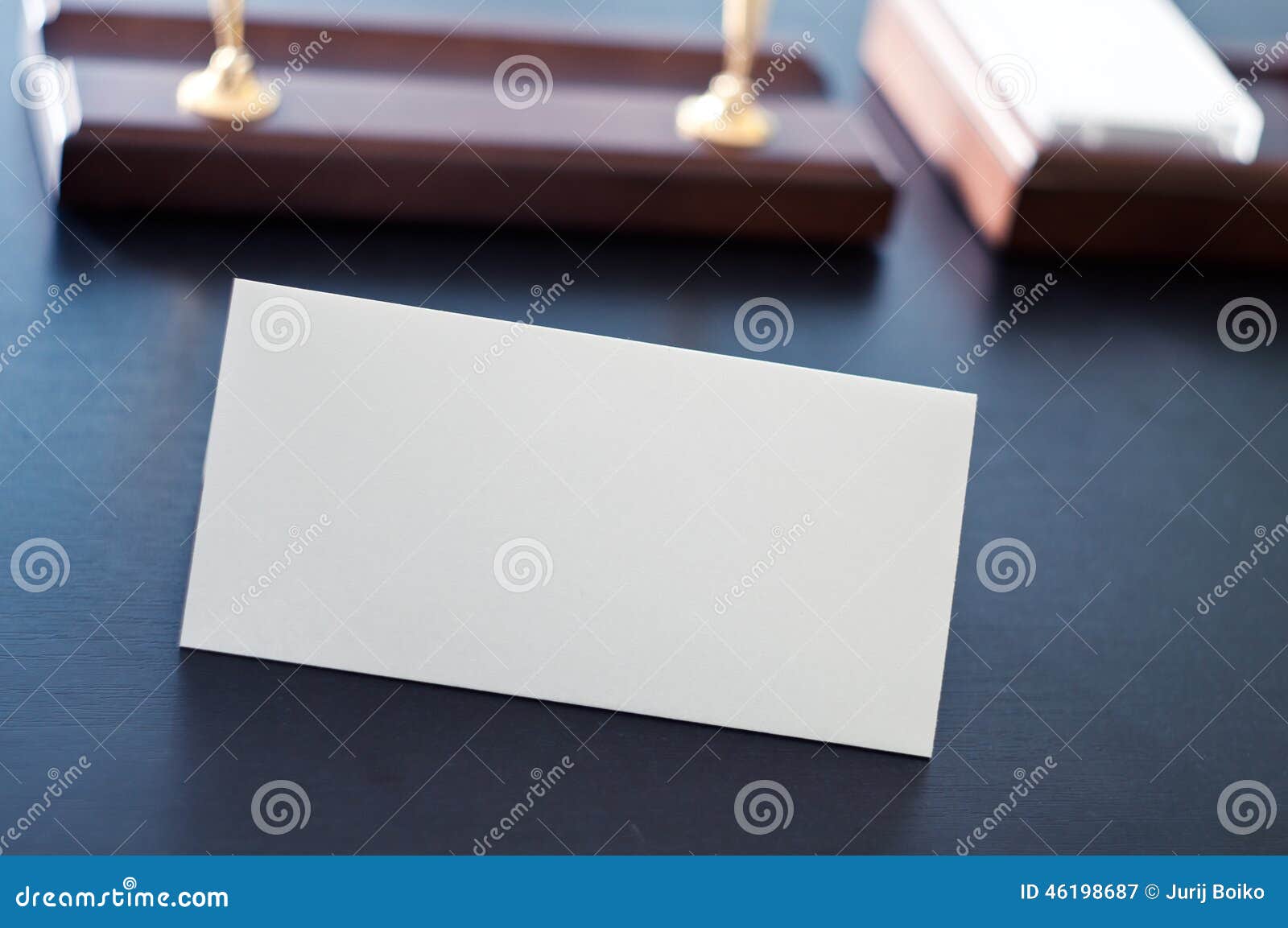 White Triangular Sign for the Label Standing on a Black Table. Stock ...