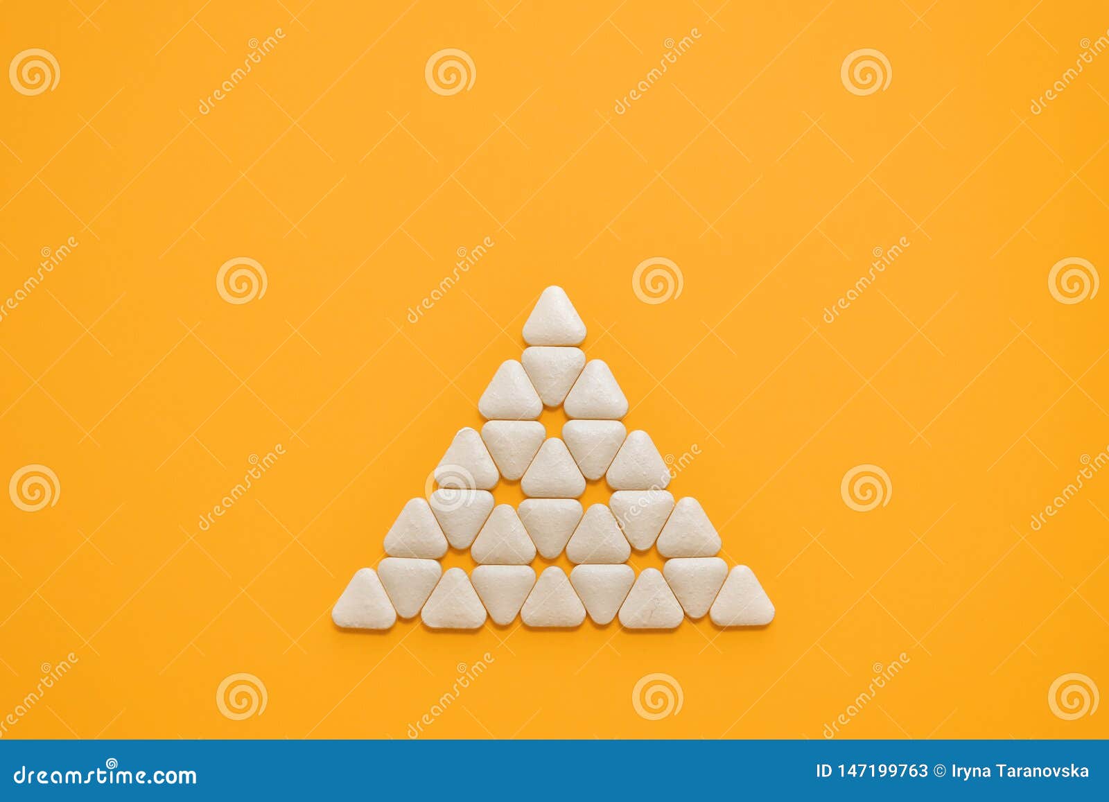 White Triangular Unusual Tablets are Laid in the Shape of a Triangle on ...