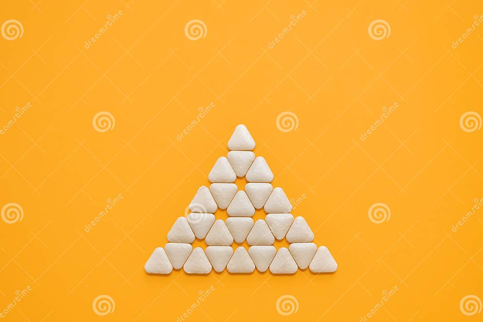 White Triangular Unusual Tablets are Laid in the Shape of a Triangle on ...
