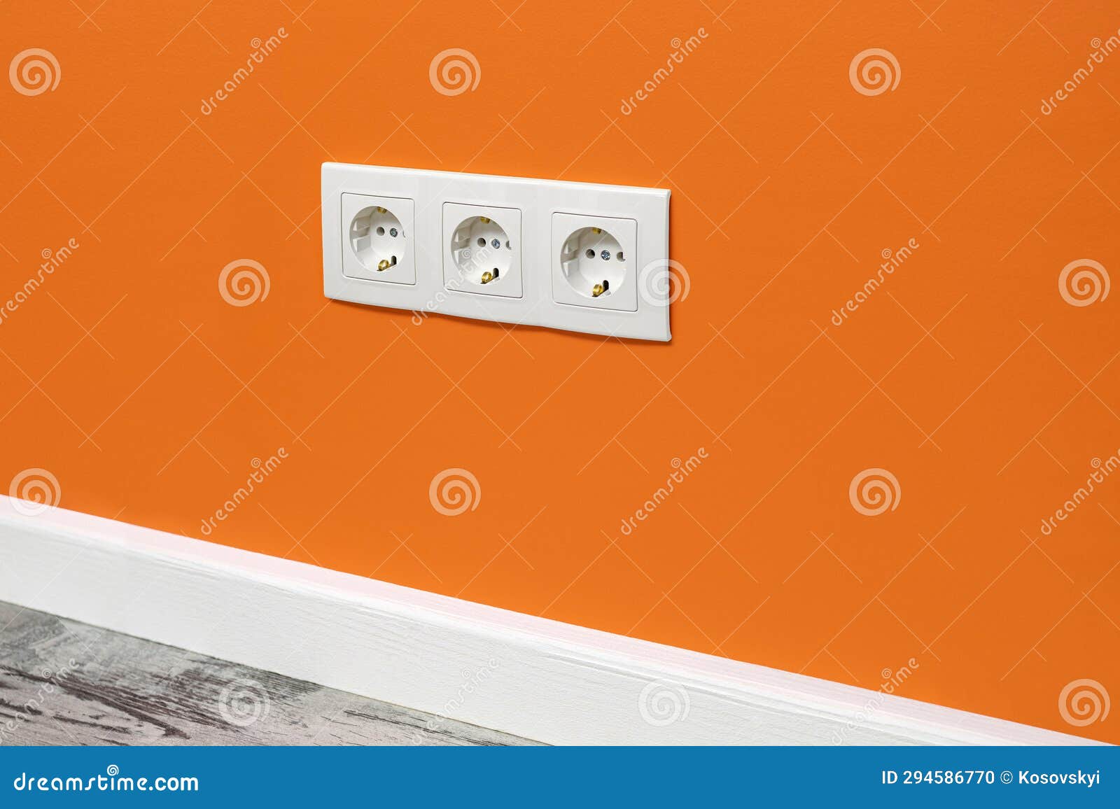 White Triple Outlet on Orange Wall Stock Photo - Image of electric ...
