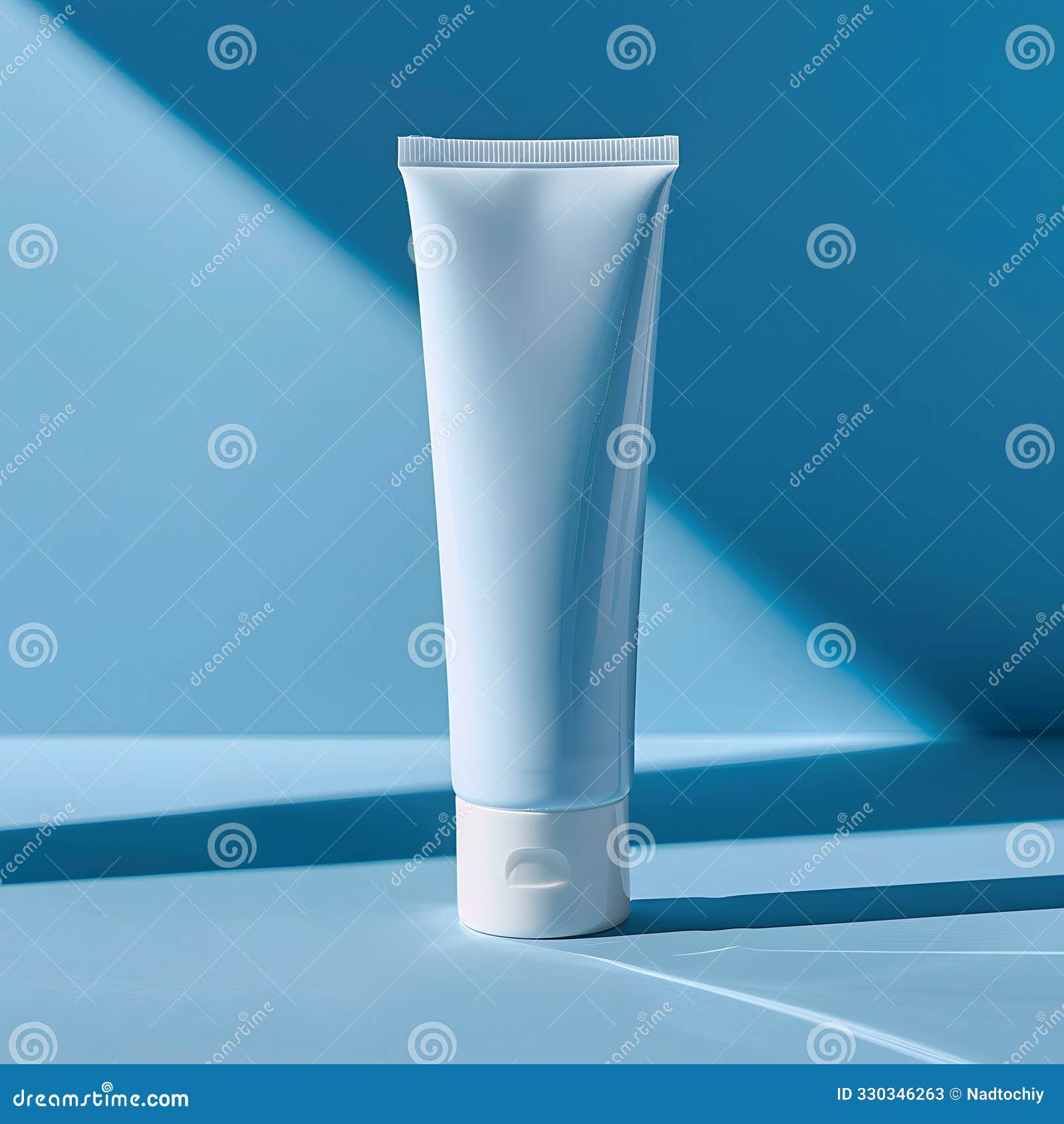 A White Tube of Toothpaste Rests on a Blue Plastic Rectangle Stock ...