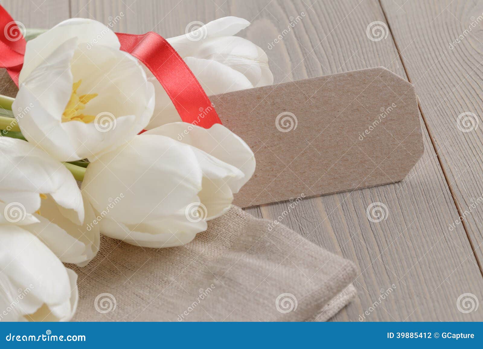 White tulips on wood table stock photo. Image of message - 39885412