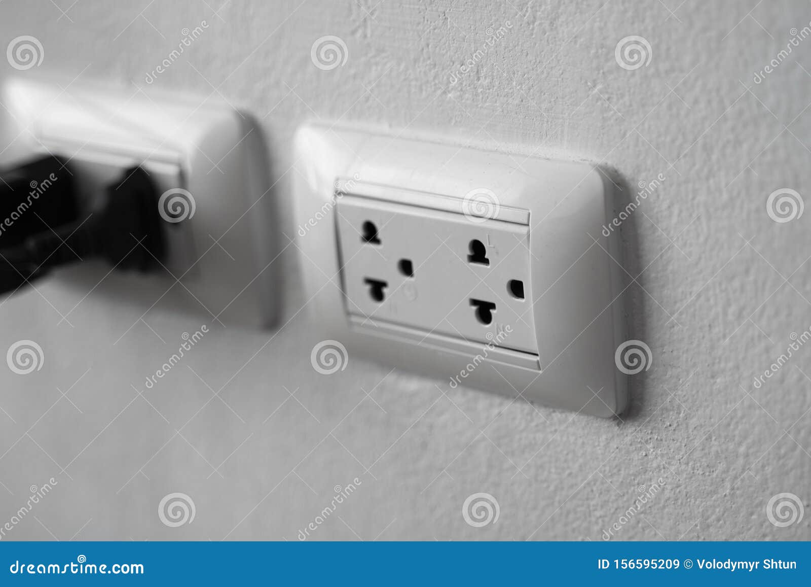 White Universal Electricity Sockets Plug on a White Wall. Stock Image ...