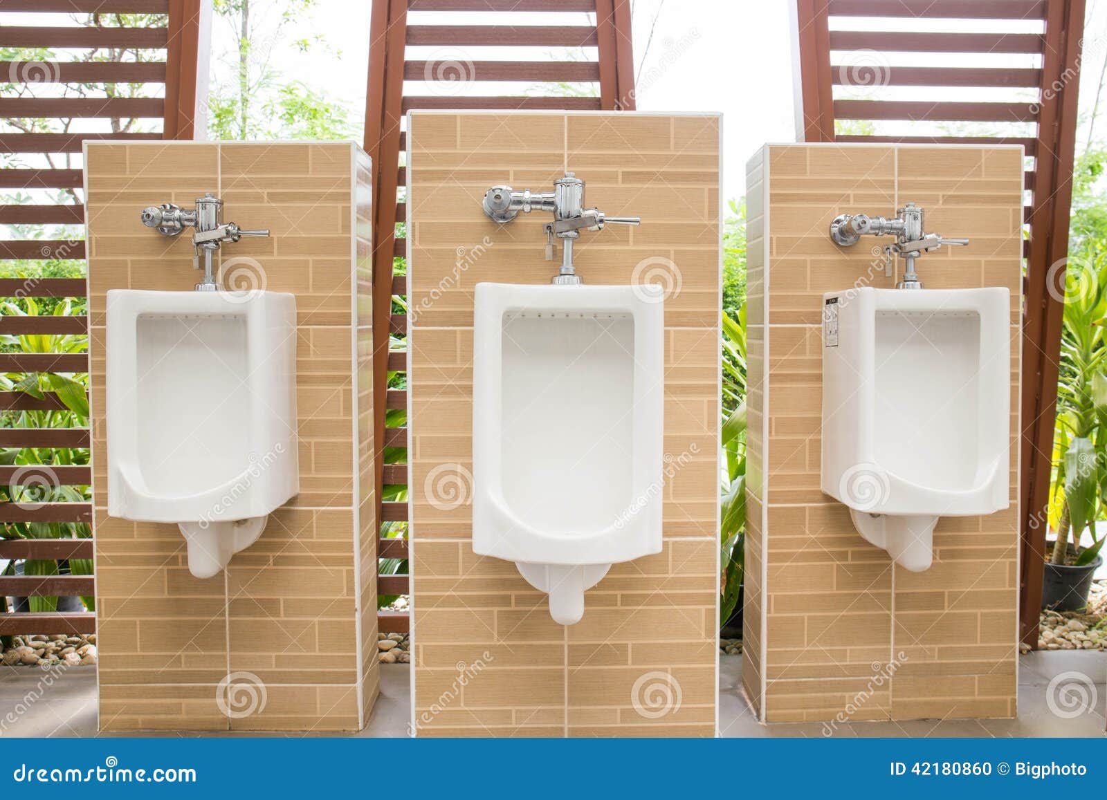 White Urinals with Ceramic Tile on Wall. Stock Photo - Image of ...