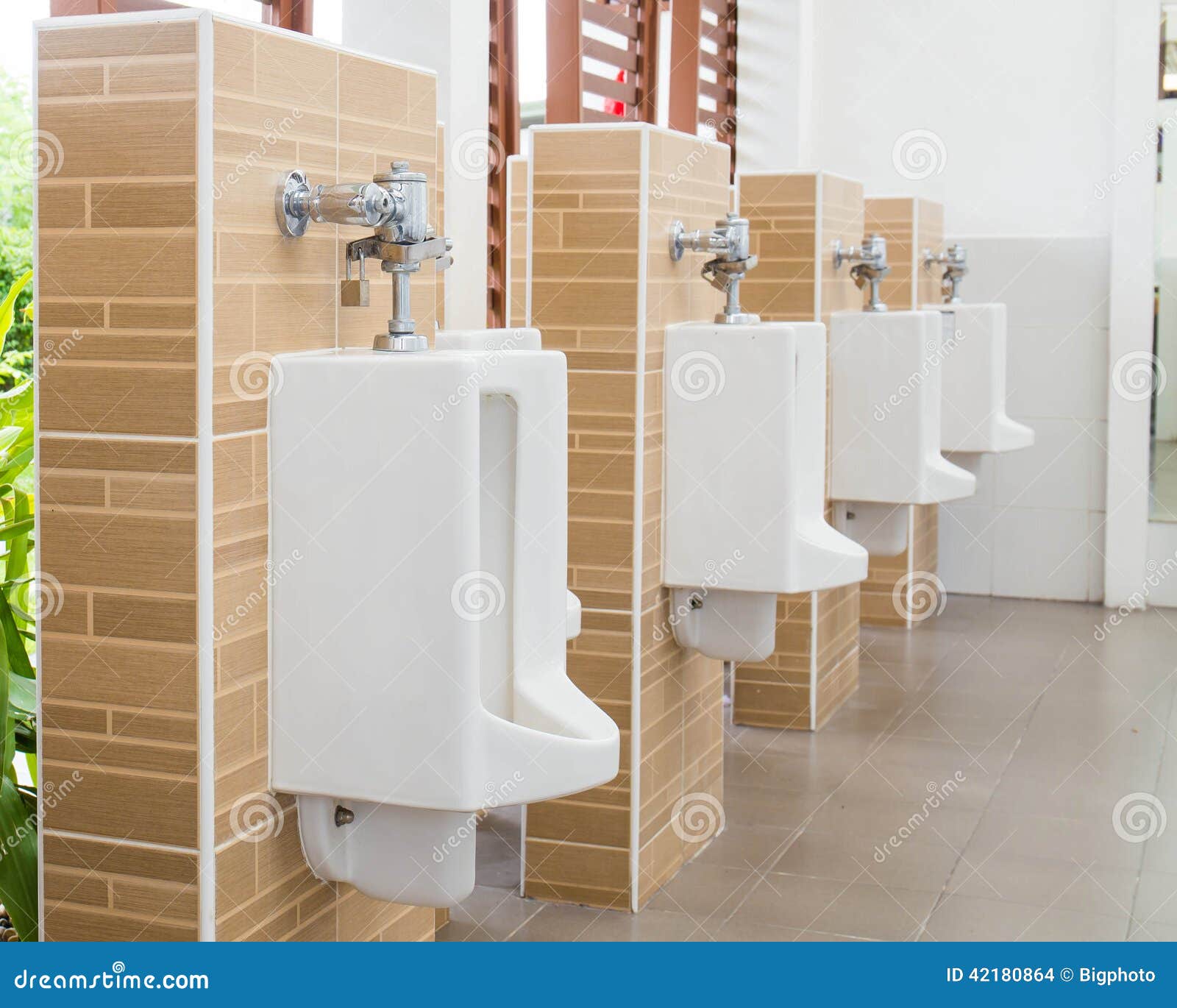 White Urinals with Ceramic Tile on Wall. Stock Photo - Image of ...