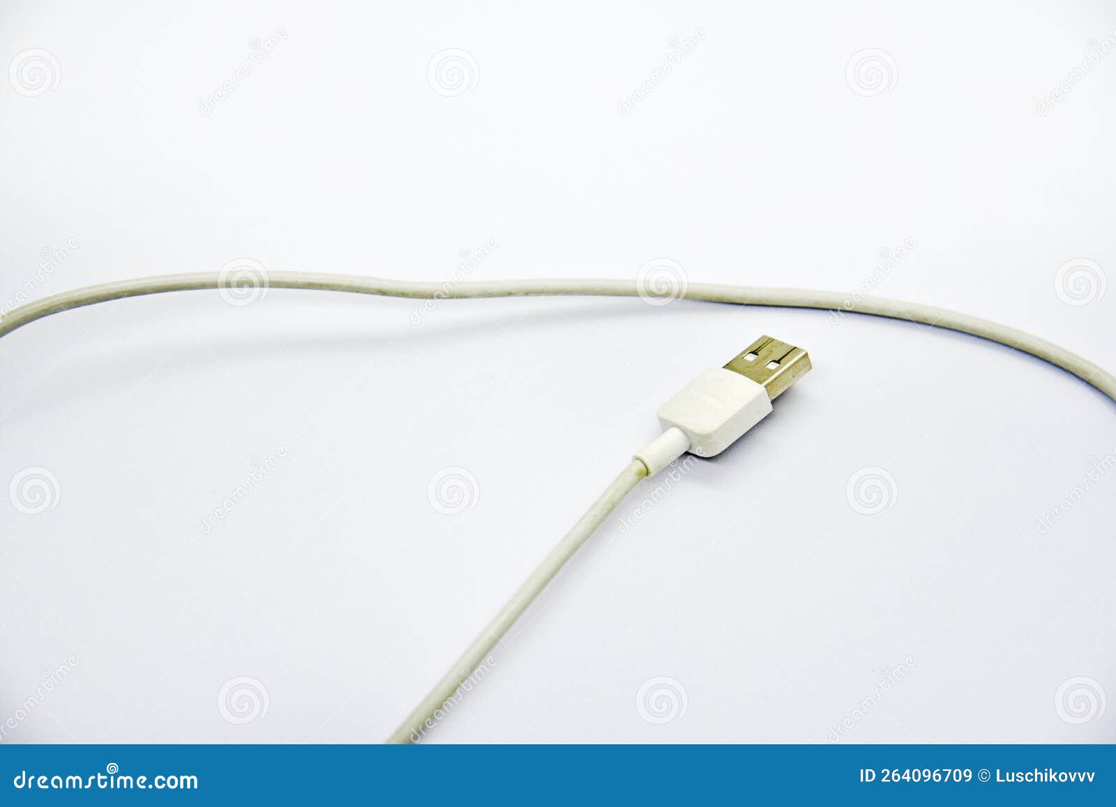 White USB Cable for Charging the Phone on a White Background. White ...