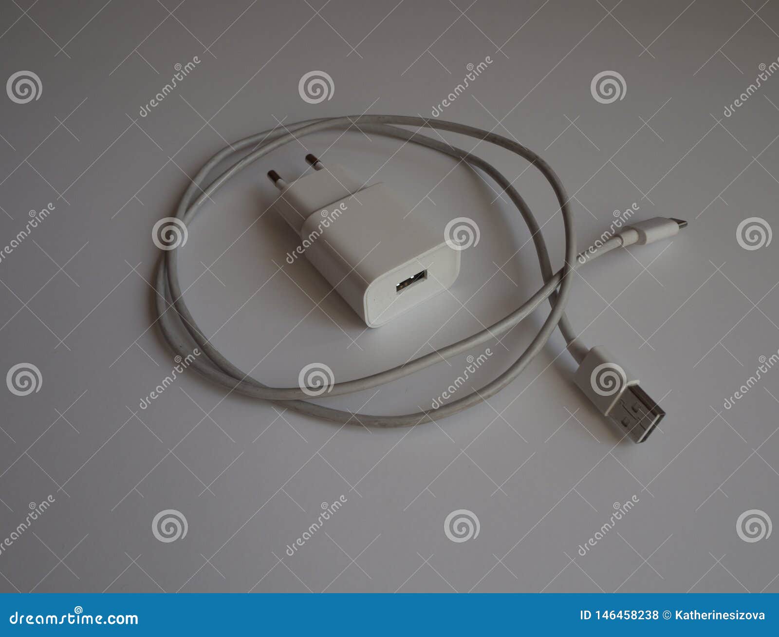 A White USB Charger for Charging a Smartphone Stock Photo - Image of ...