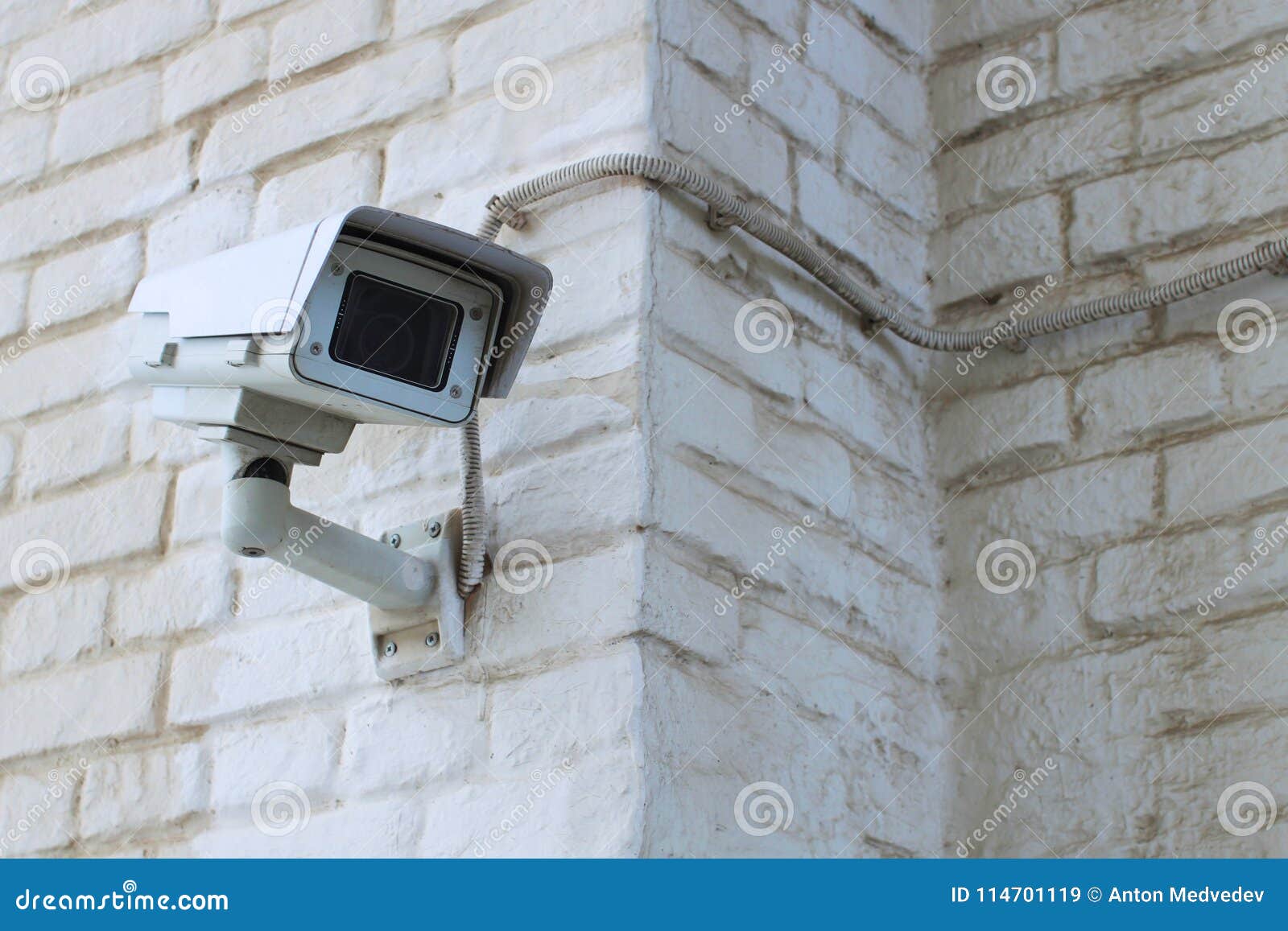 White Video Surveillance Camera on the White Wall Stock Image - Image ...