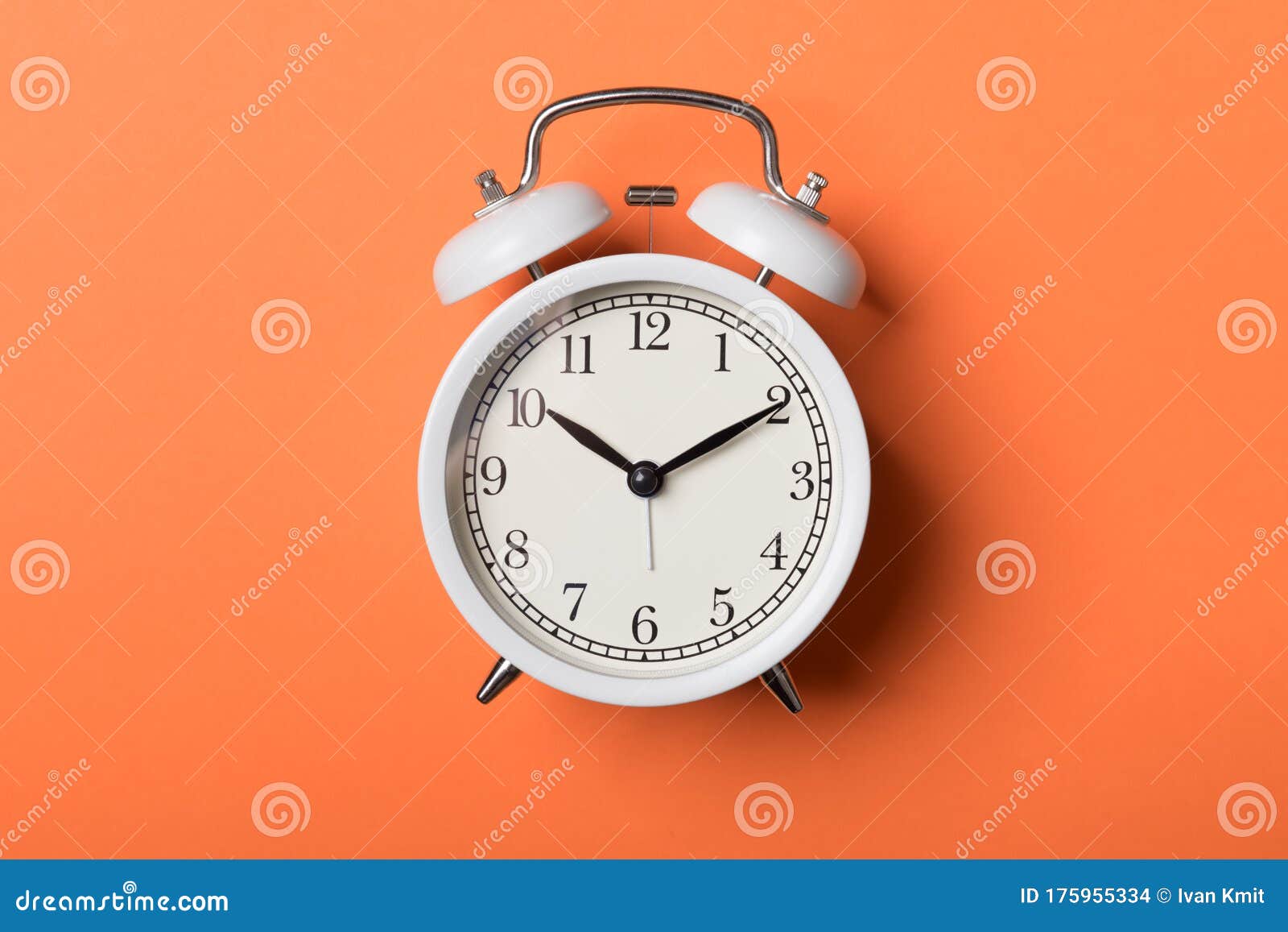 White Vintage Alarm Clock on Orange Background Stock Photo - Image of ...