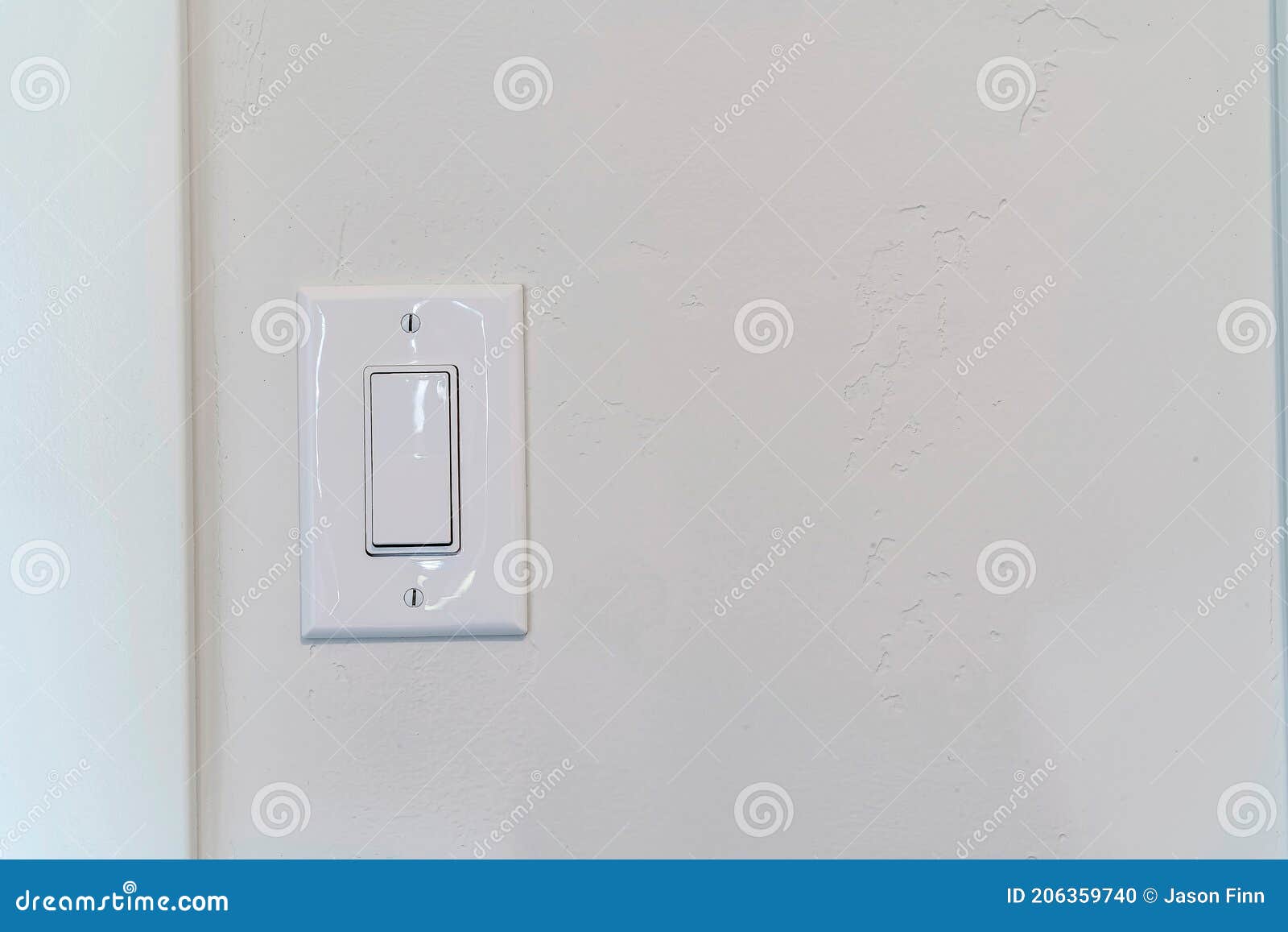 White Wall with Electrical Rocker Light Switch Inside the Room of a ...