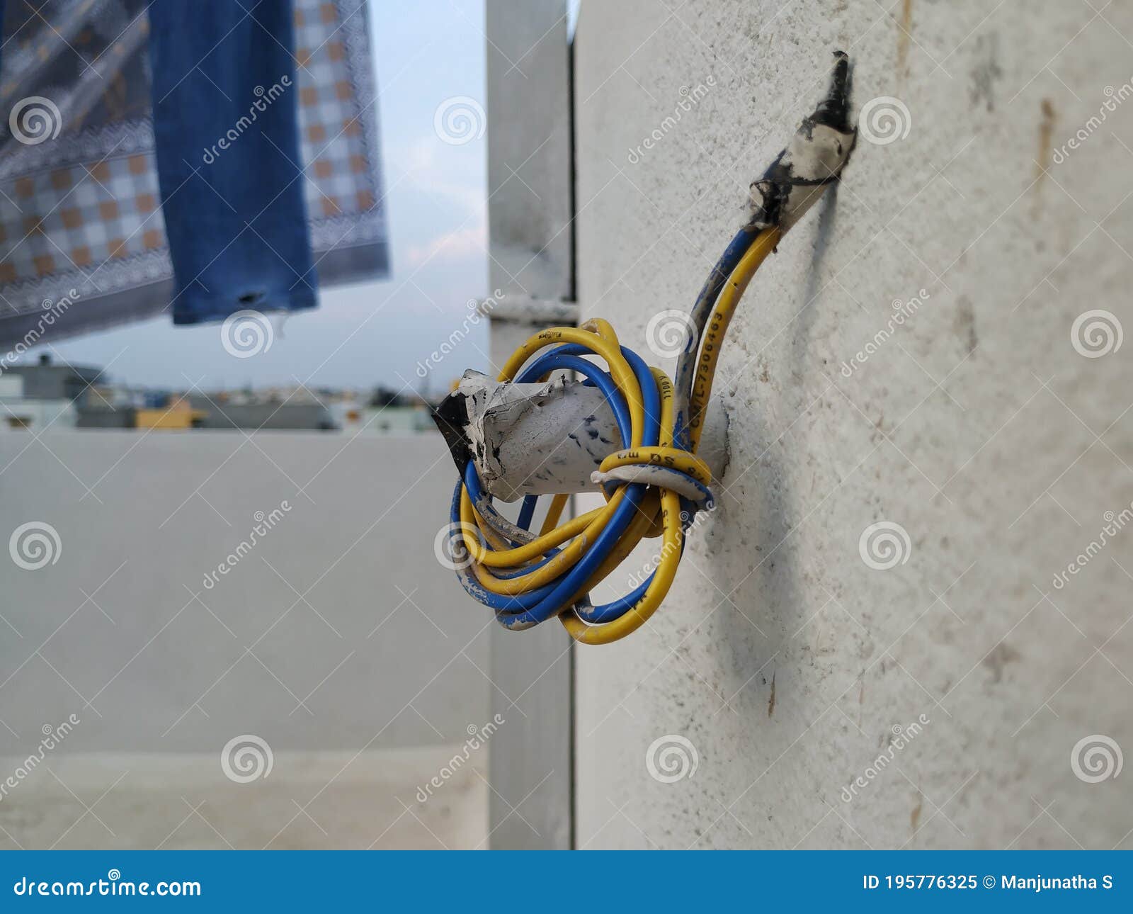 White Wall Fixed Small Plastic Pipe and Remaining Used Electrical Wires ...