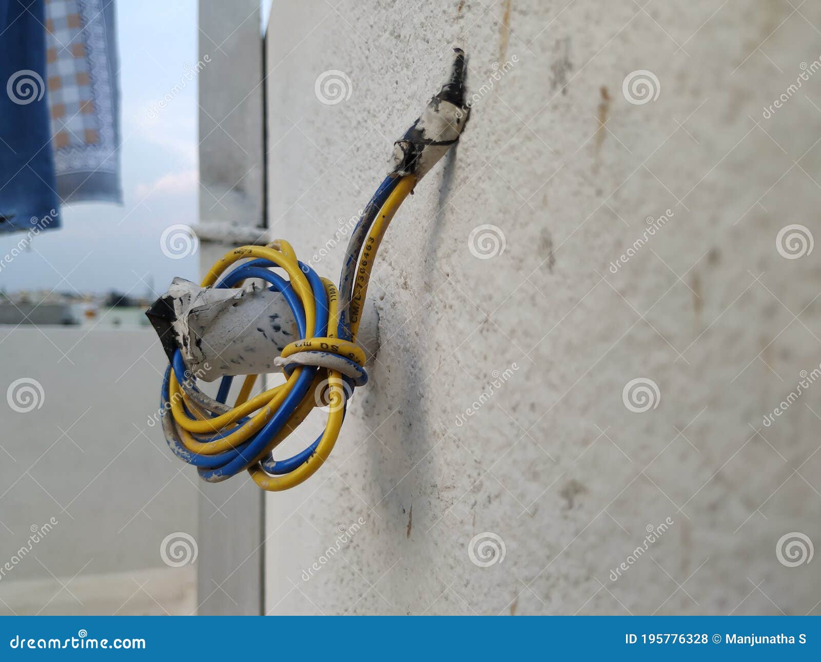 White Wall Fixed Small Plastic Pipe and Remaining Used Electrical Wires ...